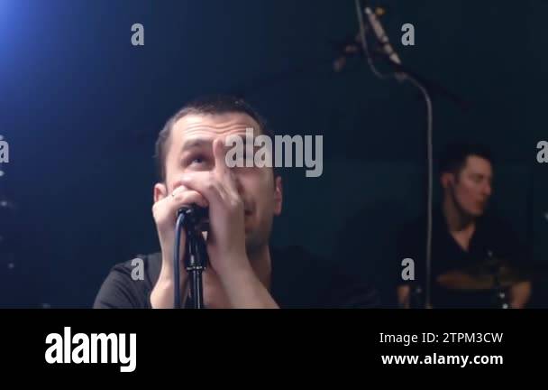 The rock band rehearses with the frontman, guitarists and drummer ...