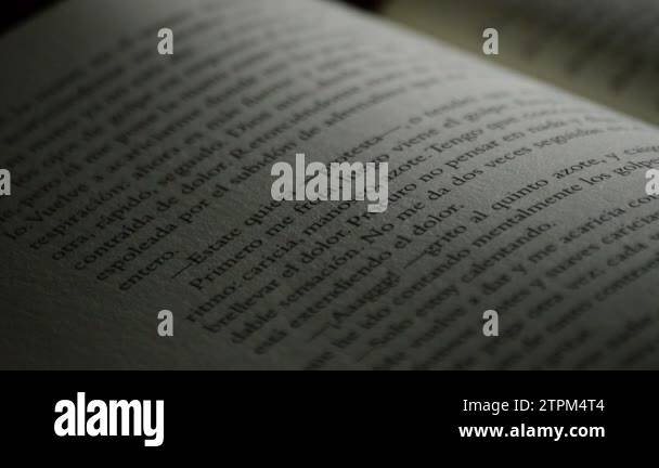 Texts, phrases and words in spanish of a page of a open book rotating ...