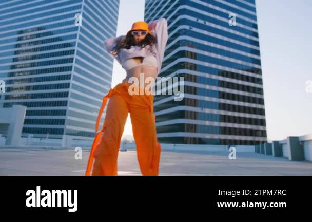 Sexy African American young woman dancing sensually on roof top. Twerk ...
