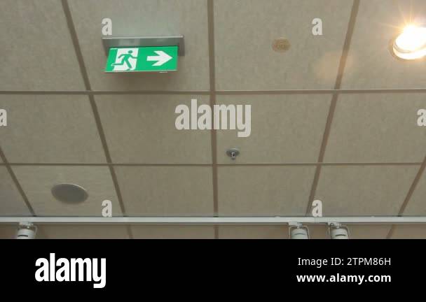 Green emergency, fire exit sign.Standard international symbol safe exit ...