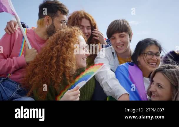 Group laughing diverse people gathered sitting outdoor to demonstrate ...
