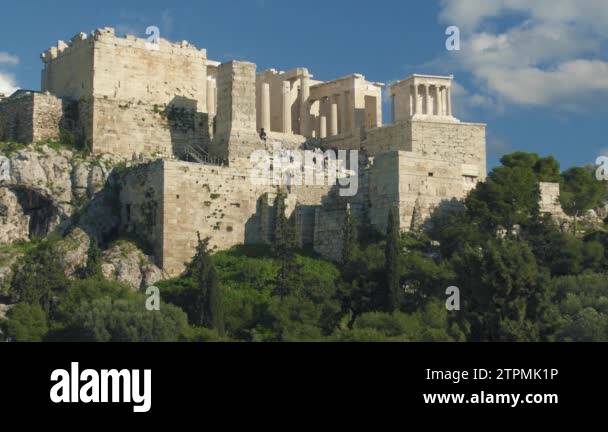 The Acropolis Ruins with Tourists. The Acropolis is one of the most ...