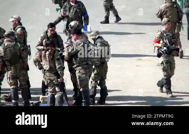 Squad of strikeball team with machine submachine guns Stock Video ...