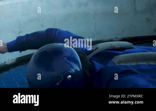 Professional skydiver flies in wind tunnel. Flying in a wind tunnel ...