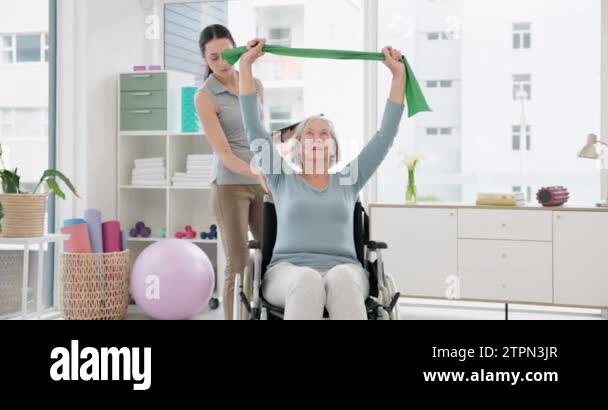 Senior woman with disability, physiotherapist and stretching band for ...