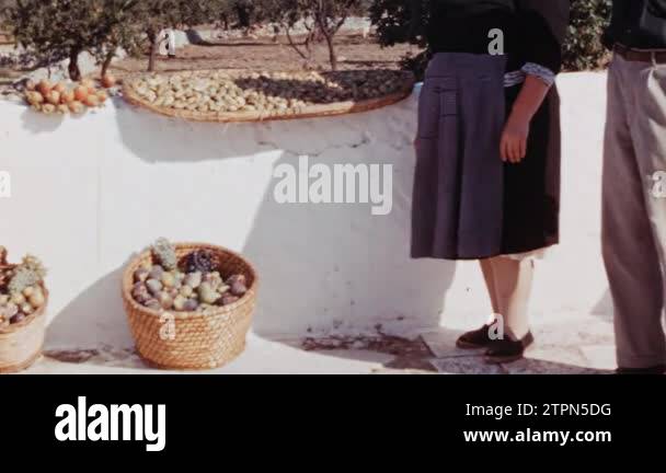 Vintage 1960s archival footage of a farmers family selling fresh ...