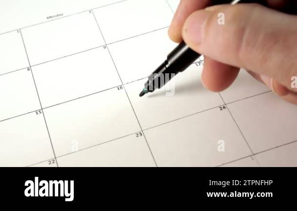 Sign the day in the calendar with a pen, draw a good bad day Stock ...