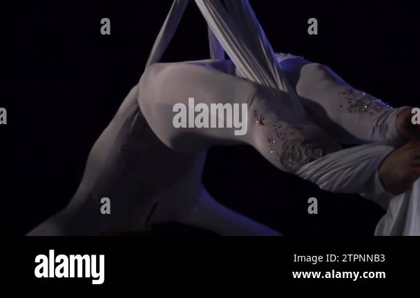 woman dancer on aerial silk, aerial contortion, aerial ribbons. Slow ...