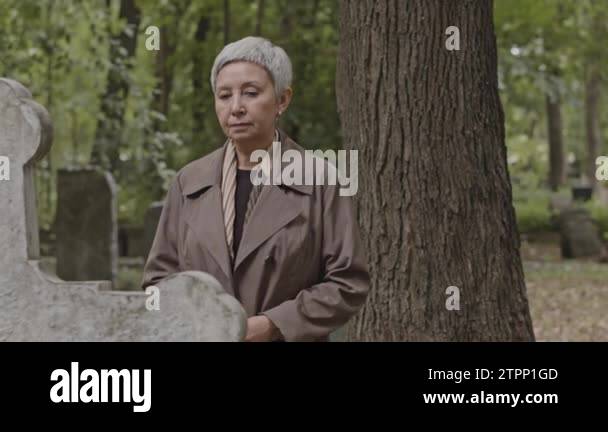 Woman standing tombstone cemetery Stock Videos & Footage - HD and 4K ...