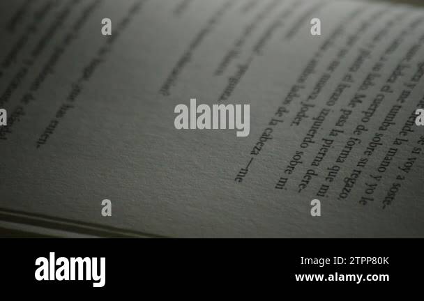 Texts, phrases and words in spanish of a page of a open book rotating ...