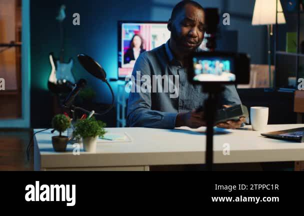 Tech content creator filming technology review of newly launched V ...