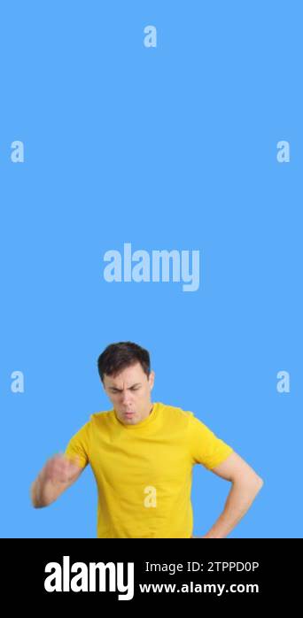 Video in studio with blue background of a foolish man thinking but cant ...