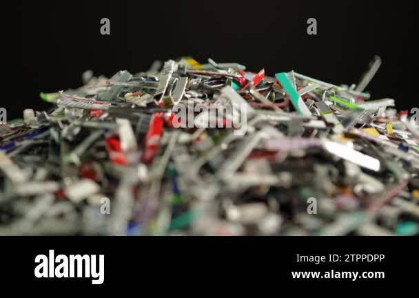 Shredded credit cards and money in bank accounts. Pile of cut bank ...