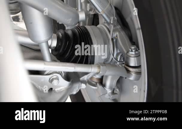 Rotation tire in motion with close up. car axis. Car engine closeup ...