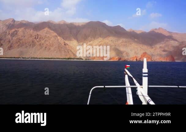 Ship travel sails along Musandam peninsula, Sultanate of Oman, Gulf of ...