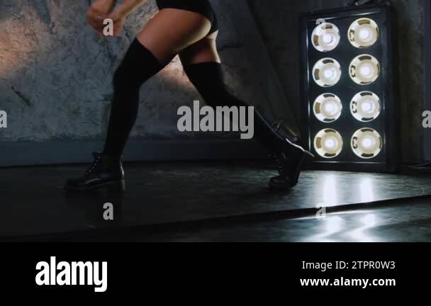 Slender beautiful sporty sexy girl doing lunges on one leg to ...