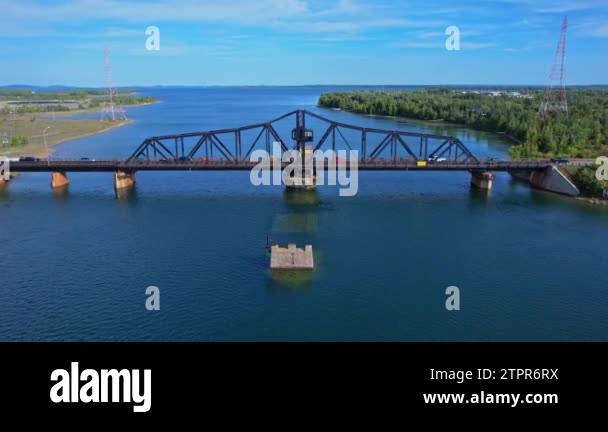 Little current swing bridge at sunny summer with blue sky. The bridge ...