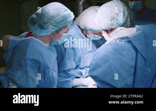 Surgical Team Performing Surgery Operation. Doctor Performing Surgery ...