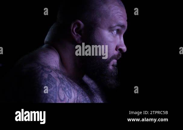 Violent face of a bald amd bearded muscular mobster. 4K UHD Stock Video ...