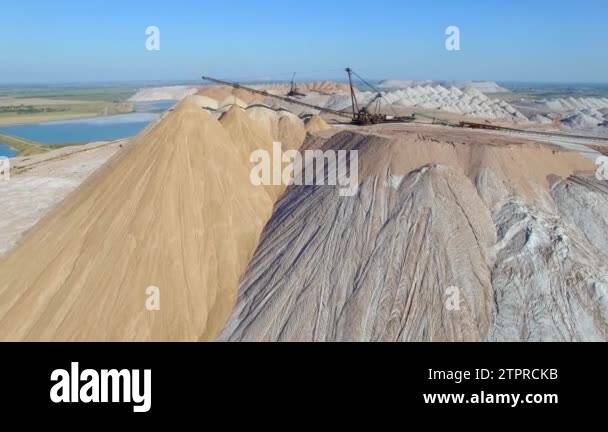 4k areal works above potash mines close up. Artificial mountains ...