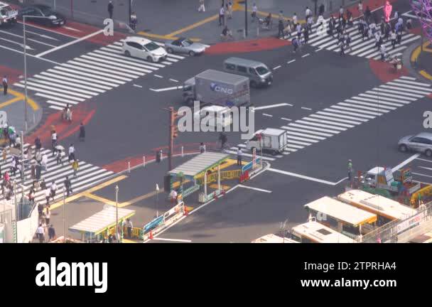 People cross the famous intersection in Shibuya, Tokyo, Japan Stock ...