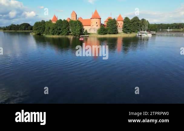 Aerial drone shot of red brick medieval castle on island in Trakai ...