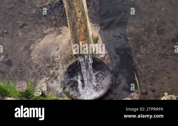 Archaic natural water source in chute. Clean, fresh, natural spring of ...