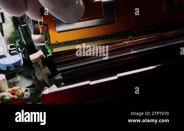 Close-up of insert or install the RAM component into the computer ...