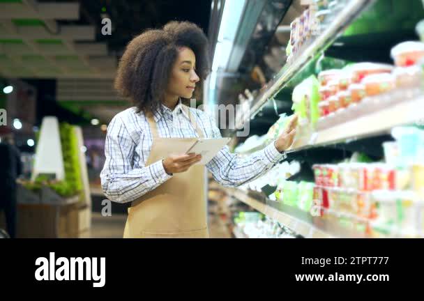 African american employee clerk working on tablet, checking condition ...