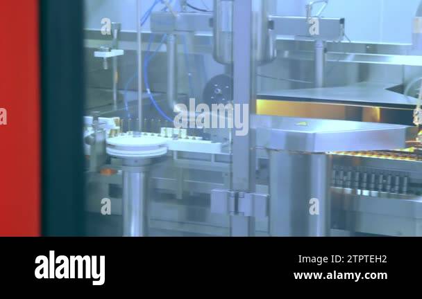 Pharmaceutical manufacturing machine at factory. Drugs manufacturing ...