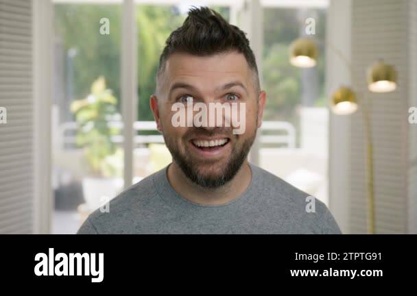 Closeup silly guy having fun. Comic male model fooling around crossing ...