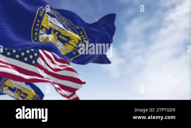 Nebraska state flag, emblazoned with its Great Seal, waves under the ...