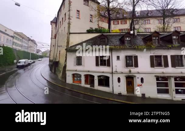 Panorama of rainy Kohlenberg Street with small houses of cafes ...