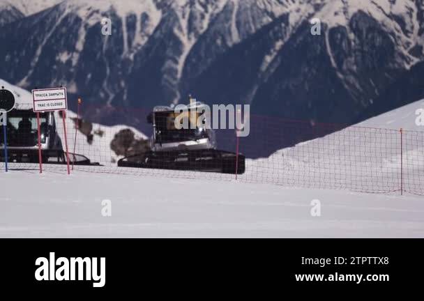 Landscape snowy mountains at ski resort. Rathraks at fence. Nature ...