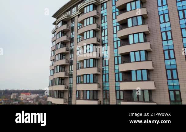 Typical apartment building in urban area. Aerial view of facade of ...