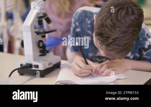 Boy looking through microscope Stock Videos & Footage - HD and 4K Video ...