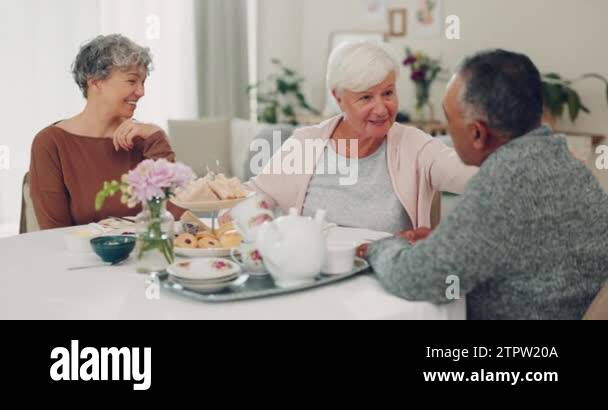 Talking, retirement and senior friends at a tea party together during a ...