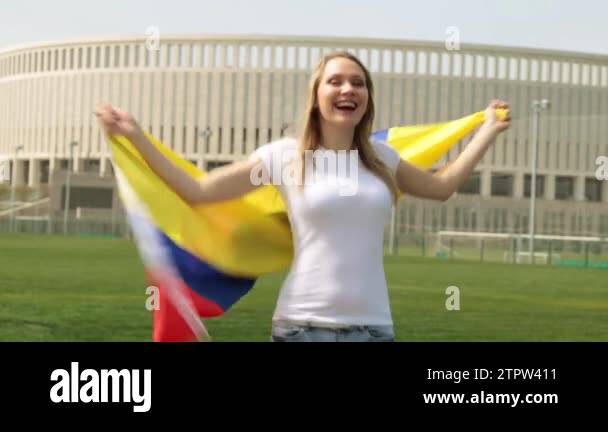 Woman with the flag of Colombia. Female soccer fan with Columbian flag ...