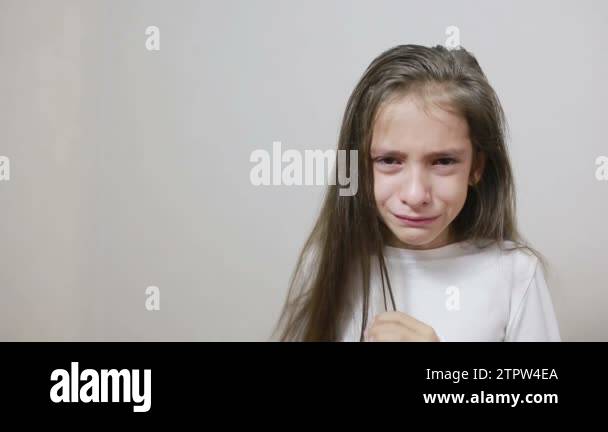 little girl crying with tears rolling down her cheeks Stock Video Footage - Alamy