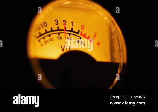 Analog round arrow indicator of audio signal level with yellow ...