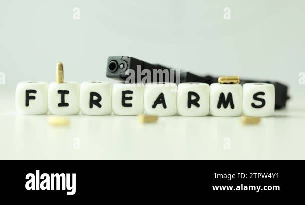 Word Firearms made from cubes with Latin letters against automatic gun ...