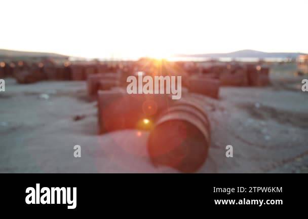 The video is shot in the sunlight. Dump of empty oil barrels. Used zoom ...