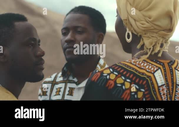 Zoom in portrait of three native African American tribe members in ...