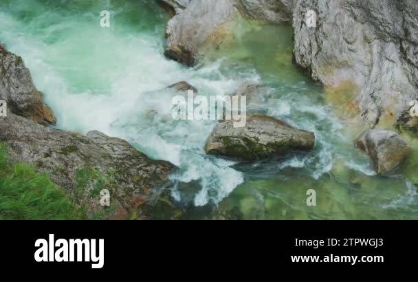 Clear fast mountain river water flowing close up. Strong stream in ...