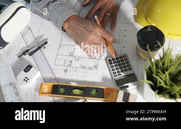 Architect workplace. Architectural building design and construction plans with blueprints paper ...