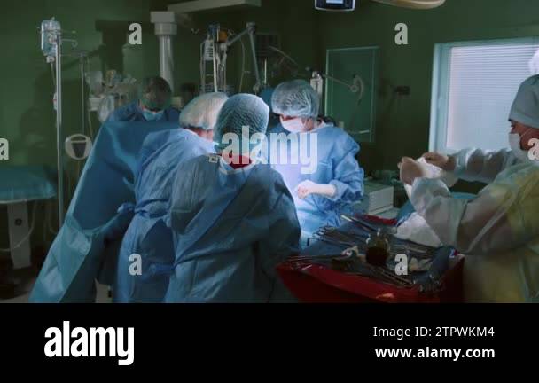 Doctor Performing Surgery Using Sterilized Equipment. Surgical Team ...