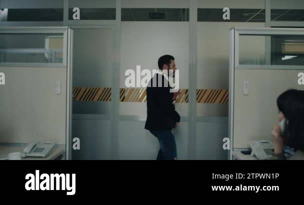 Office men coming at work dancing , all his colleagues encourage him ...