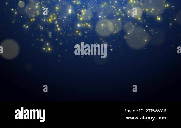 Gold sparks glitter special light effect. Glow sparkles on dark blue ...