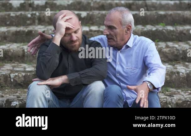 father talking and consoling her son who lost his job Stock Video ...