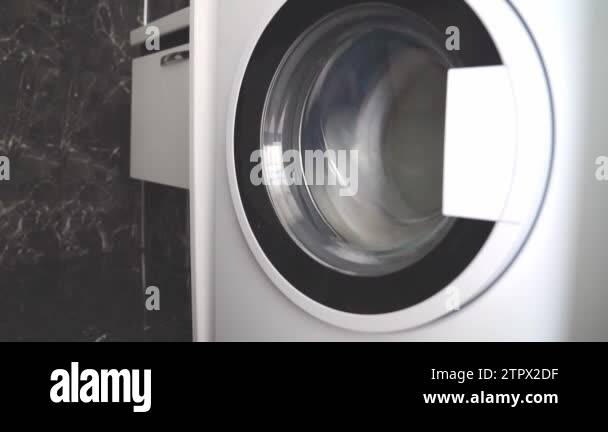Drying things in washing machine, side view Stock Video Footage - Alamy